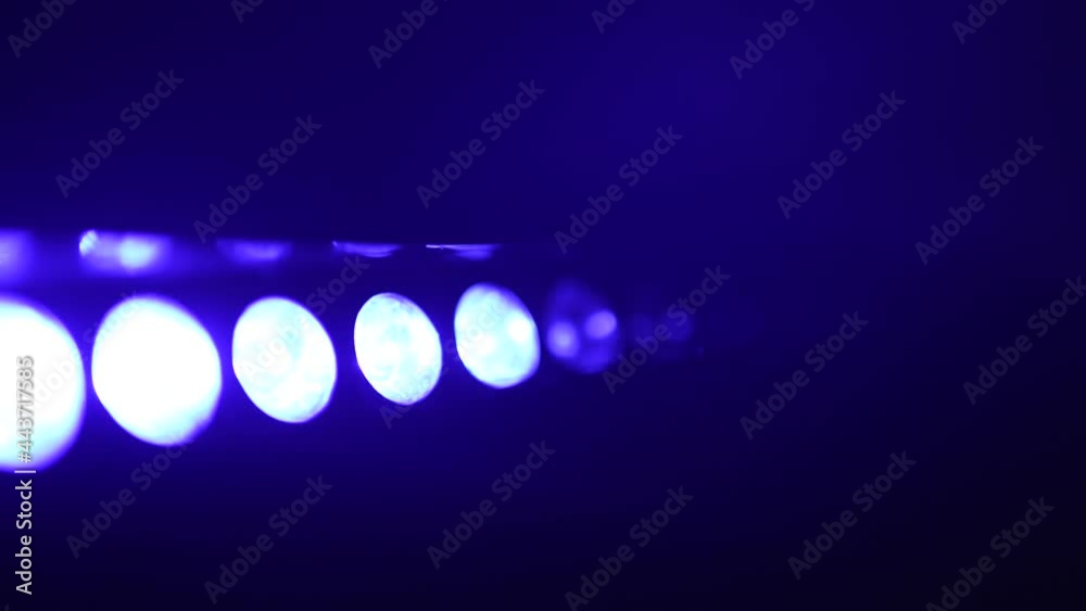 Lens flares from a police car flashers. Red and blue light flash ...