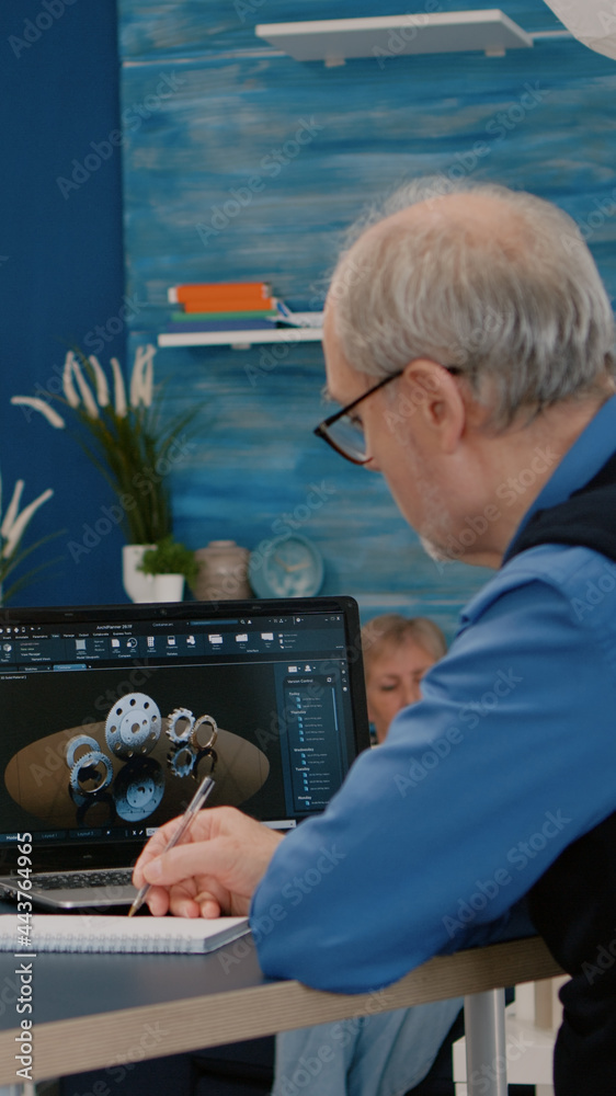 Senior remote man architect working on modern cad program analysing ...