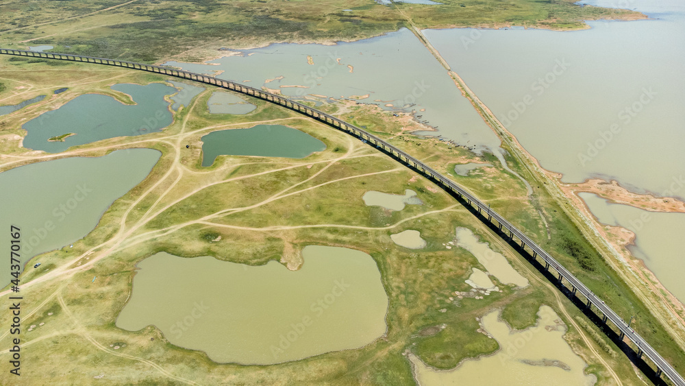 Aerial Unseen view of railroad tracks of floating Train bridge with ...