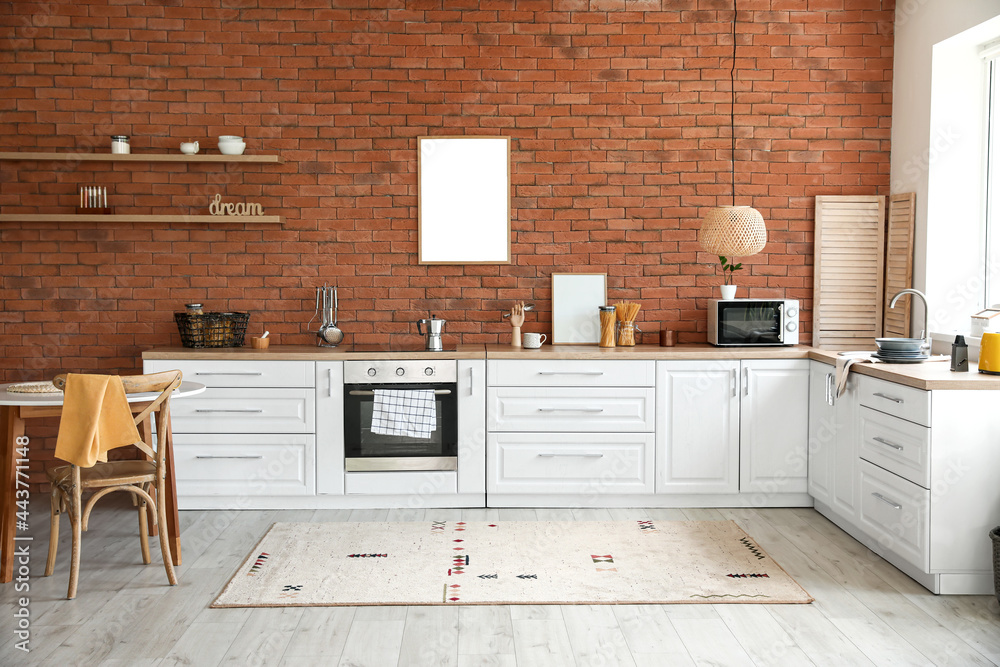 Interior of modern kitchen with blank photo frames Stock Photo | Adobe ...