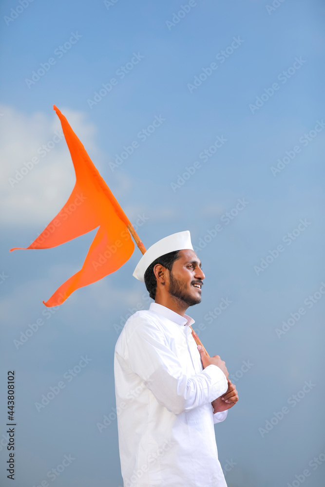 Young indian man (pilgrim) in traditional wear and waving religious ...