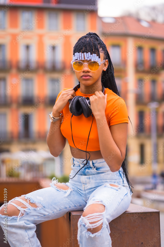 Street Style of a young trap dancer with braids. She pose from the ...