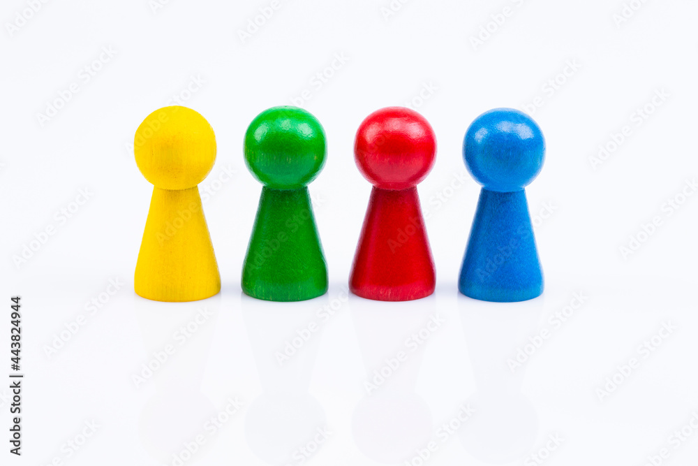 The photo shows different colored wooden figures isolated on white ...