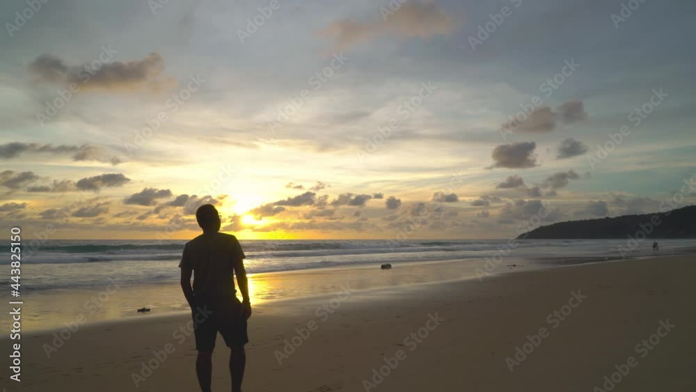 Travel video. Scene of Dark skinned asian man Relaxing on beach in ...