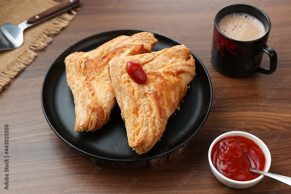 Many chicken puffs Pattie pastries, popular bakery snacks with tomato ...