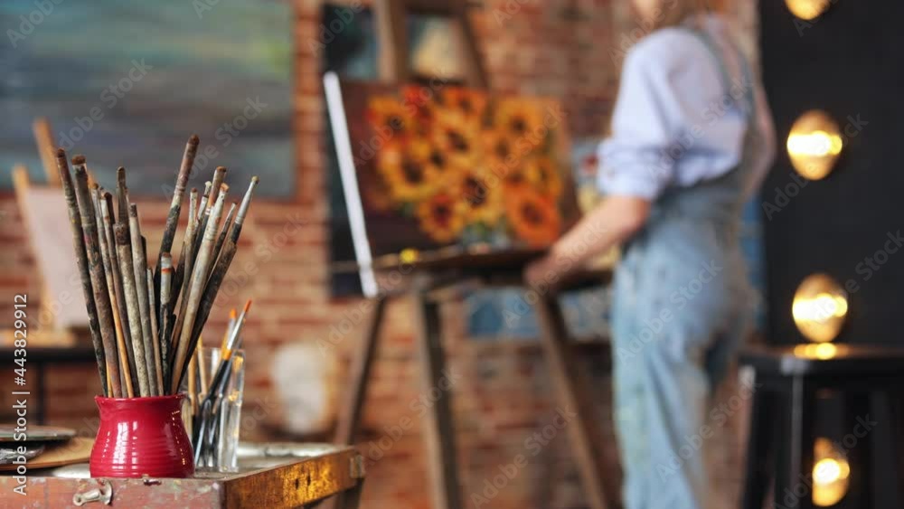 Working process in art studio. Set of painting brushes and palette ...