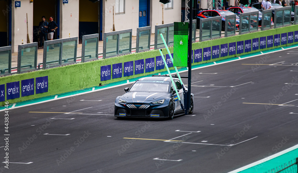 Opening gate green light start racing electric Cupra touring car on ...