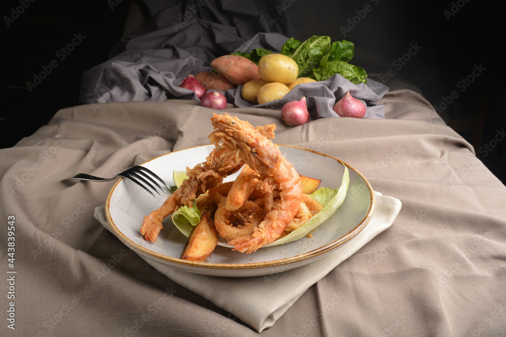 deep fried crispy tiger prawn and calamari with french fries Peruvian ...