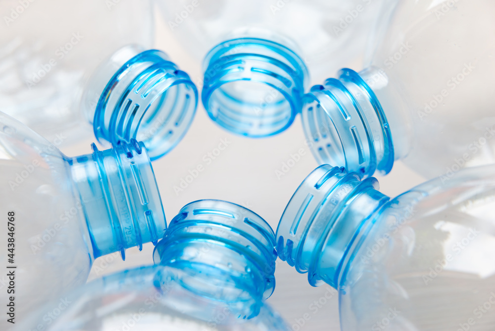 Transparent plastic bottles, on a clear surface. Transparent bottle ...