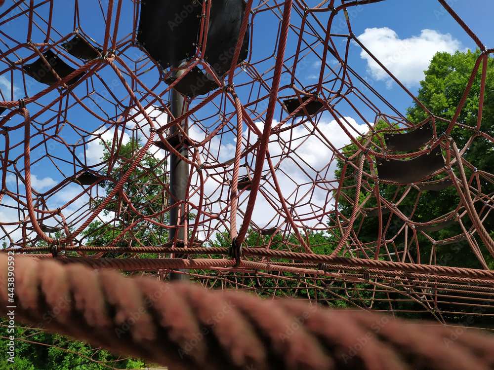 High rope climbing frame on a playground in summer to encourage ...