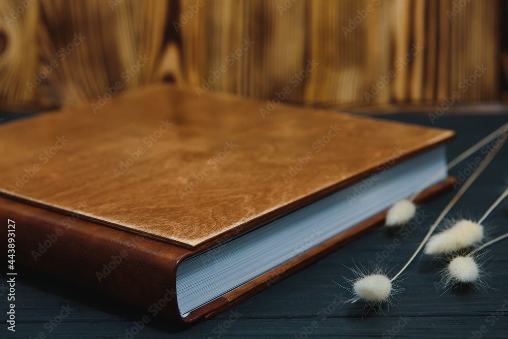 Luxury wooden photo book on natural background. Family memories ...