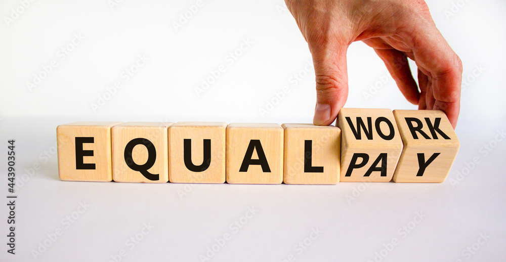 Equal pay and work symbol. Businessman turns wooden cubes and changes ...