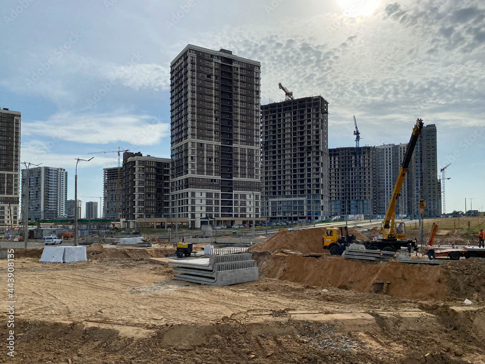 Tall modern beautiful buildings and houses are concrete skyscrapers ...