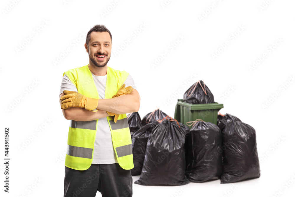 Waste collector in a uniform and gloves posing and smiling Stock Photo ...