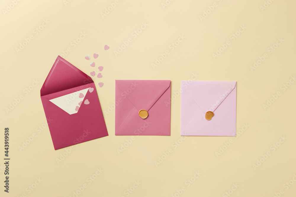Pink envelope with paper hearts and closed envelopes Stock Photo ...