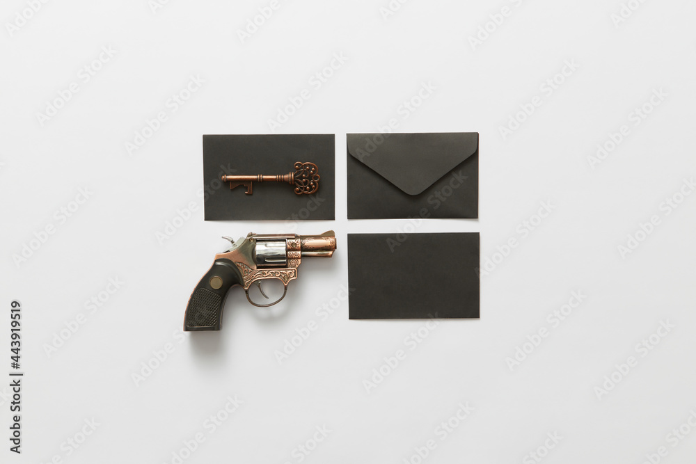 Black envelopes with key and gun Stock Photo | Adobe Stock