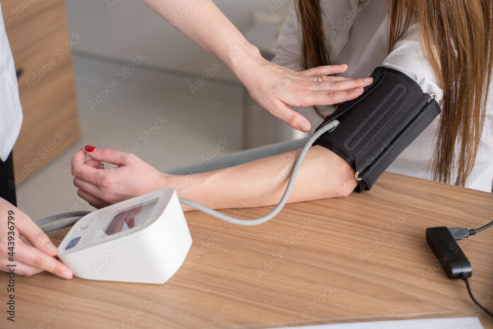Checking Patient Blood Pressure Stock Photo | Adobe Stock