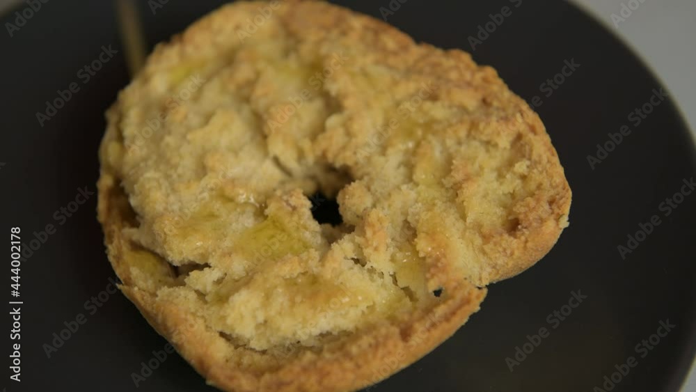 the process of preparing a classical frisella with tomato, oregano and ...