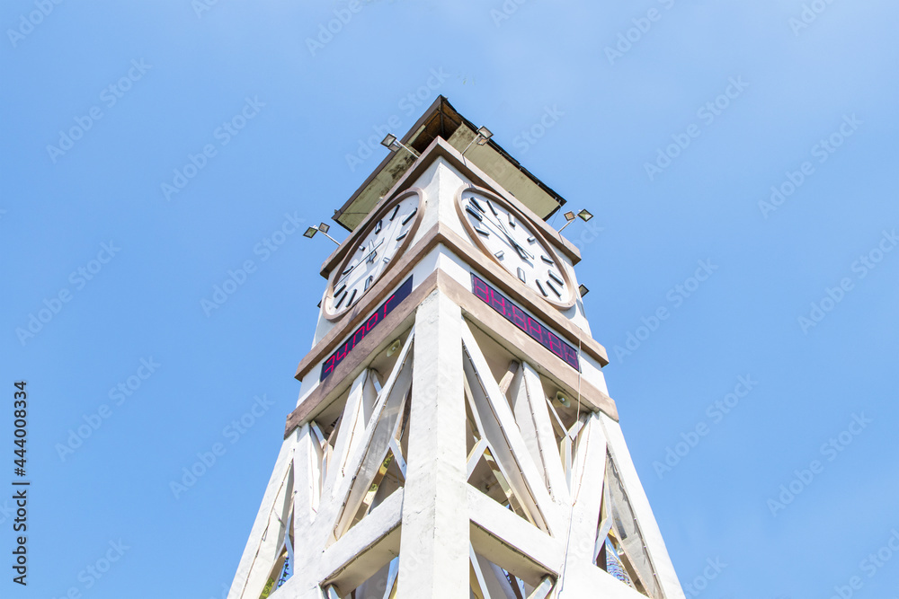 A close-up photo of a large clock tower used to view time and ...