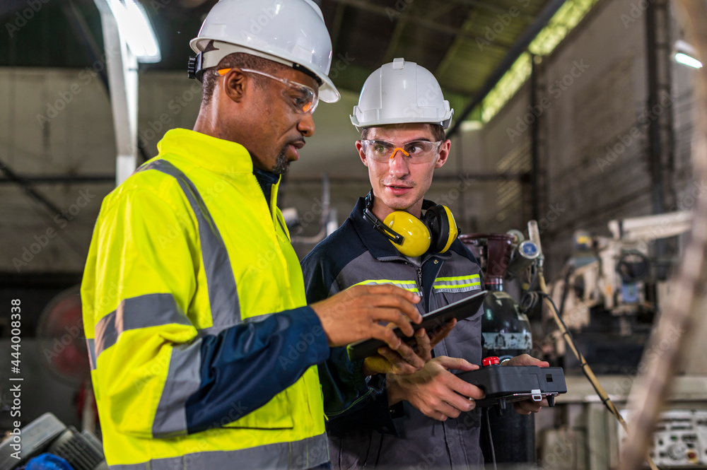 Robotics control engineers setting and maintain spare parts of ...