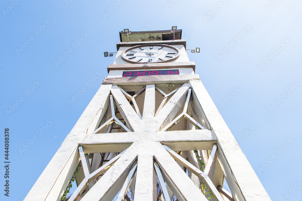 A close-up photo of a large clock tower used to view time and ...