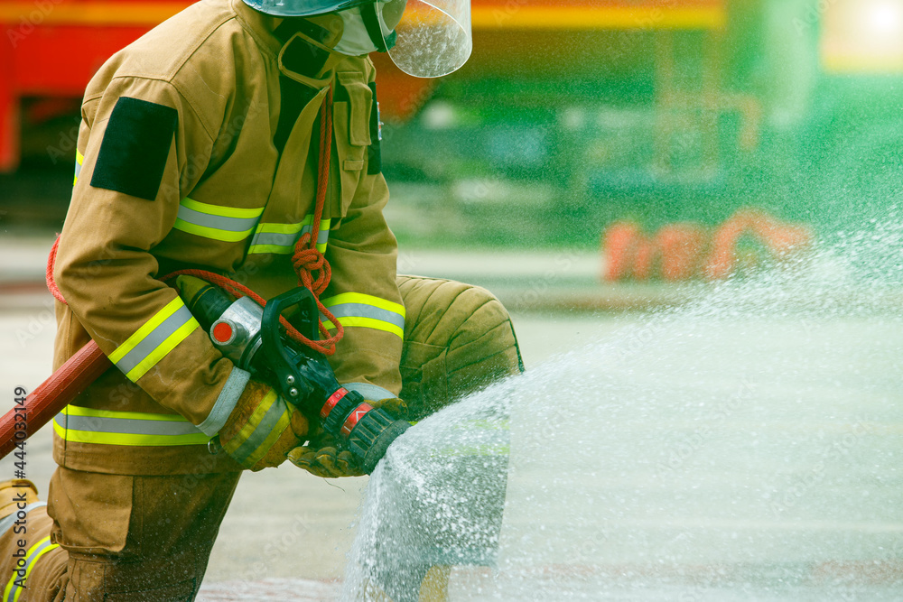 Water jet splashing from a fire fighting firehose nozzle Stock Photo ...