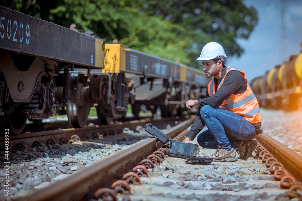 Engineer under inspection and checking construction process railway ...