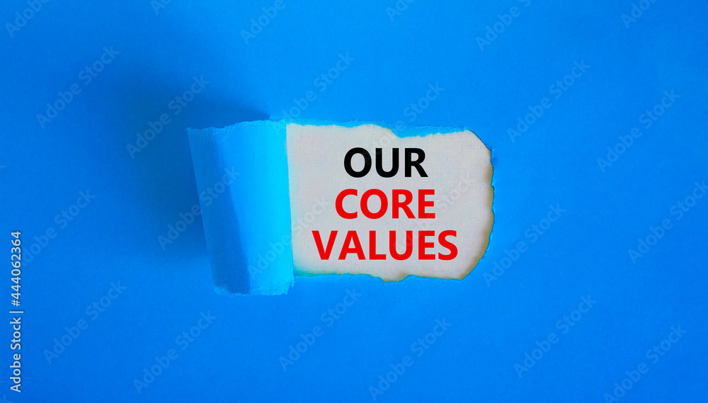Our core values symbol. Words 'Our core values' appearing behind torn ...