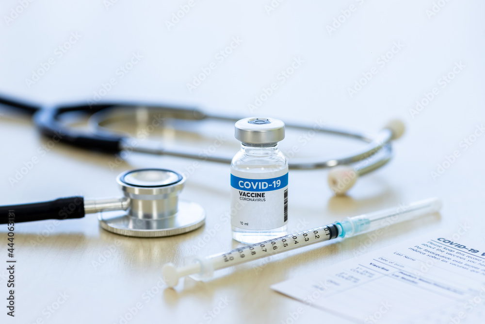 Vaccination concept and medicine: syringe with coronavirus vaccine and ...