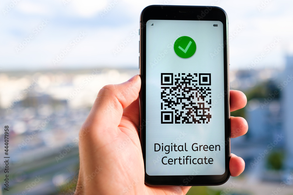 Covid pass with QR code on the screen in smartphone in mans hand on the ...