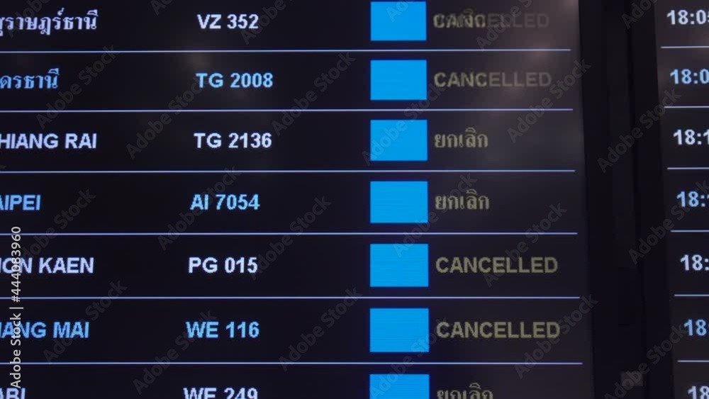 Flight cancellations on departure board screen, cancelled trip due to ...