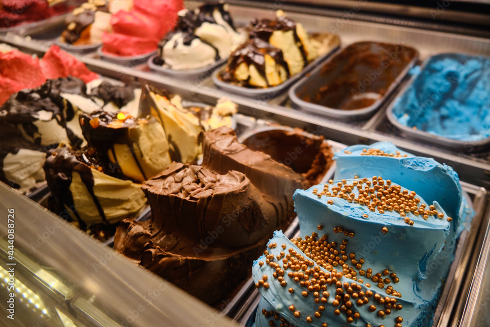 Lots of ice creams at showcase fridge display. Stock Photo | Adobe Stock