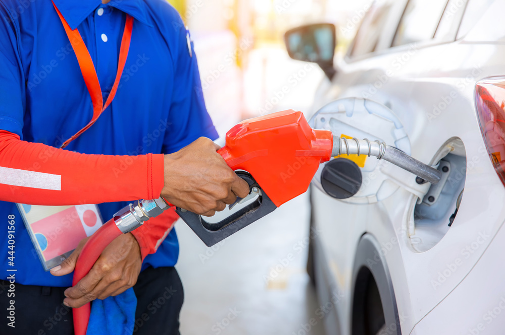 Hand Man Refill and filling Oil Gas Fuel at station. Gas station ...