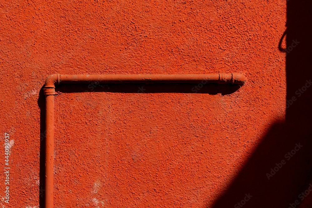 Water pipes on a colored wall Stock Photo | Adobe Stock