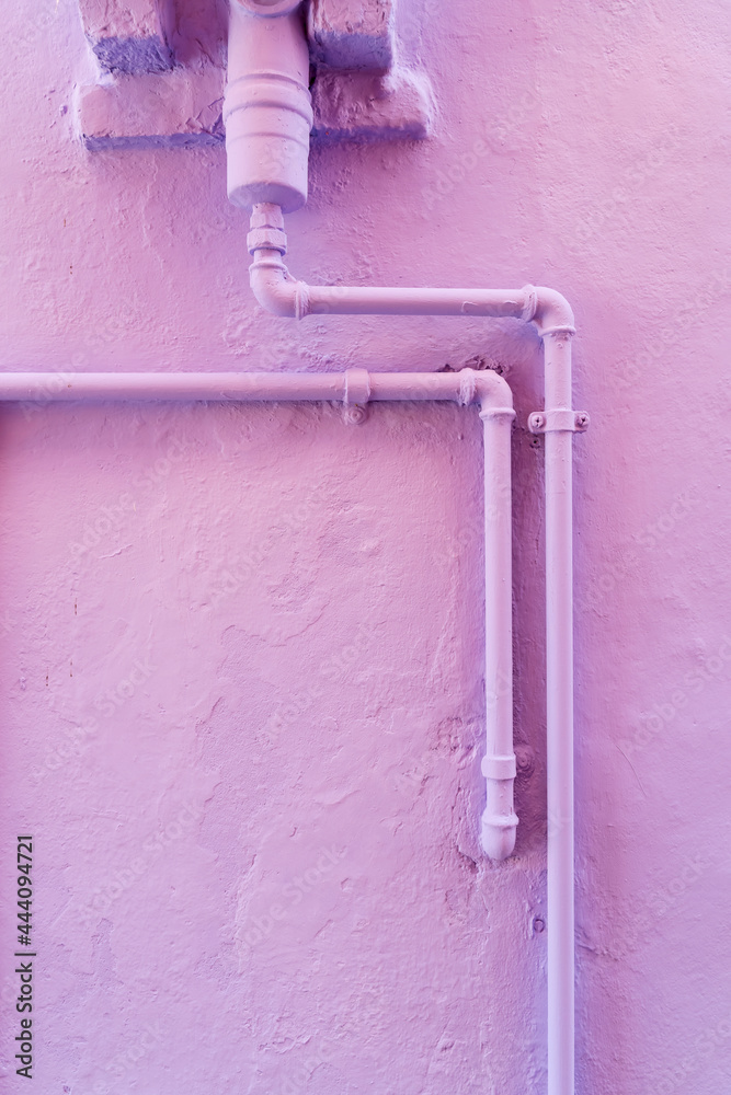 Water pipes on a colored wall Stock Photo | Adobe Stock