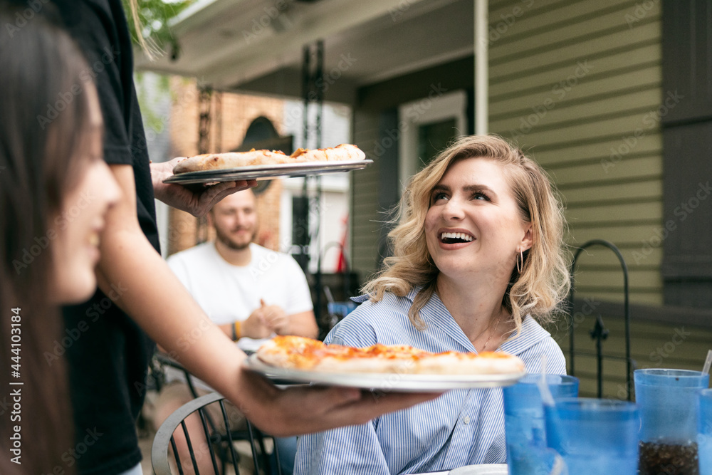 Dining: Server Brings Pepperoni Pizza To Table Stock Photo | Adobe Stock