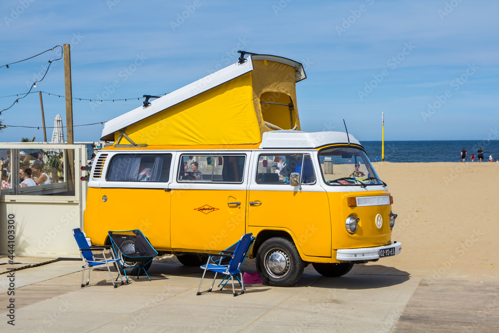 Scheveningen beach, the Netherlands - May 21, 2017: yellow VW combi ...