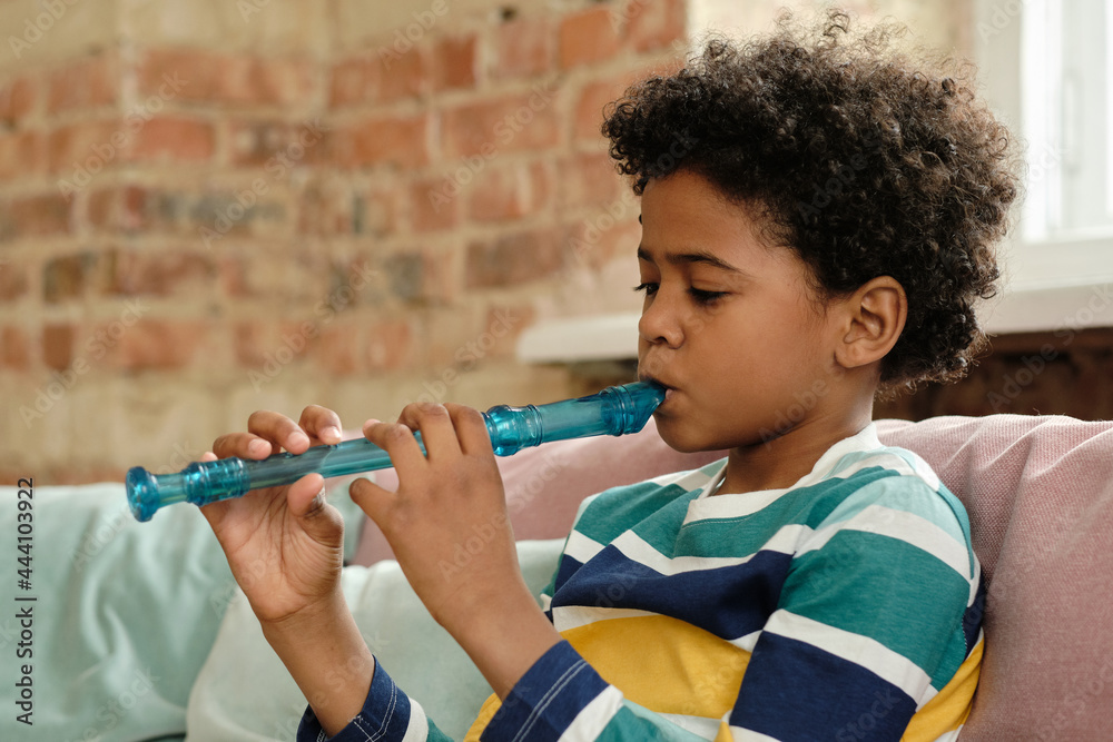 African-American Boy Playing Flute Stock Photo | Adobe Stock