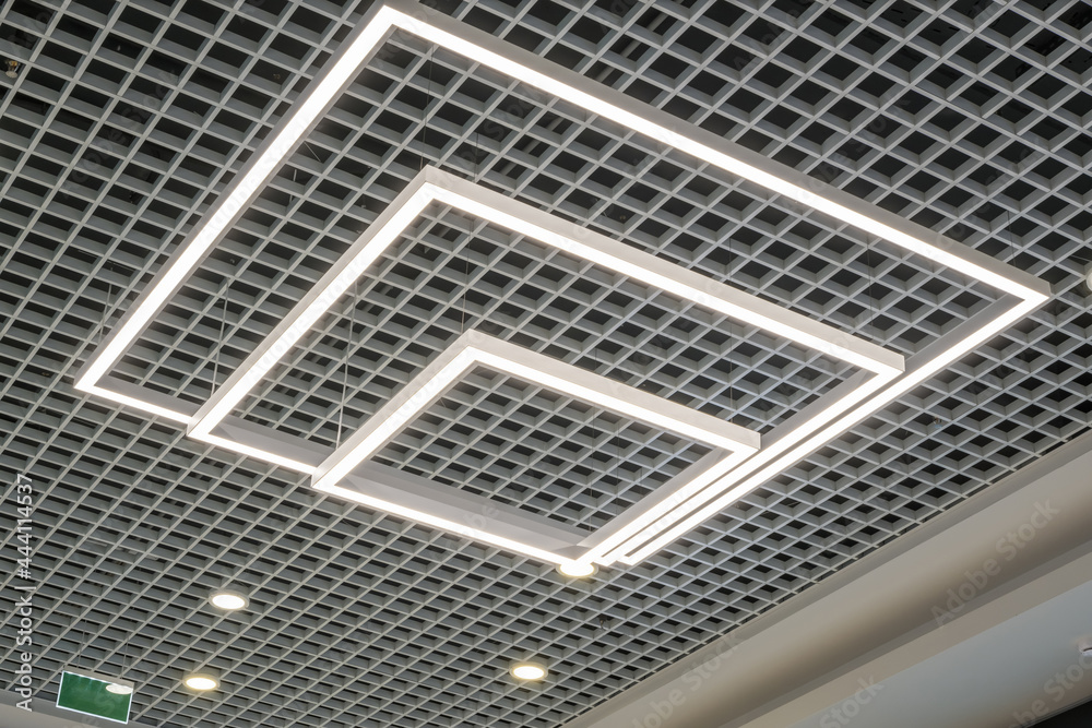 suspended and grid ceiling with halogen spots lamps and drywall ...