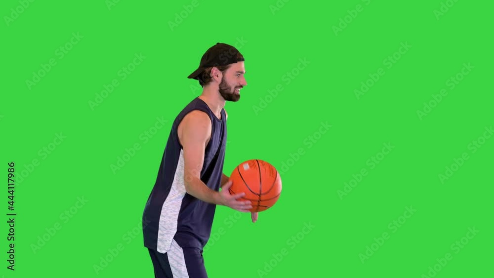 Basketball player walking bouncing a ball on a Green Screen, Chroma Key ...