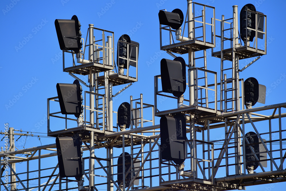 Fotka „A cluster of railway signals on a tower spanning multiple ...