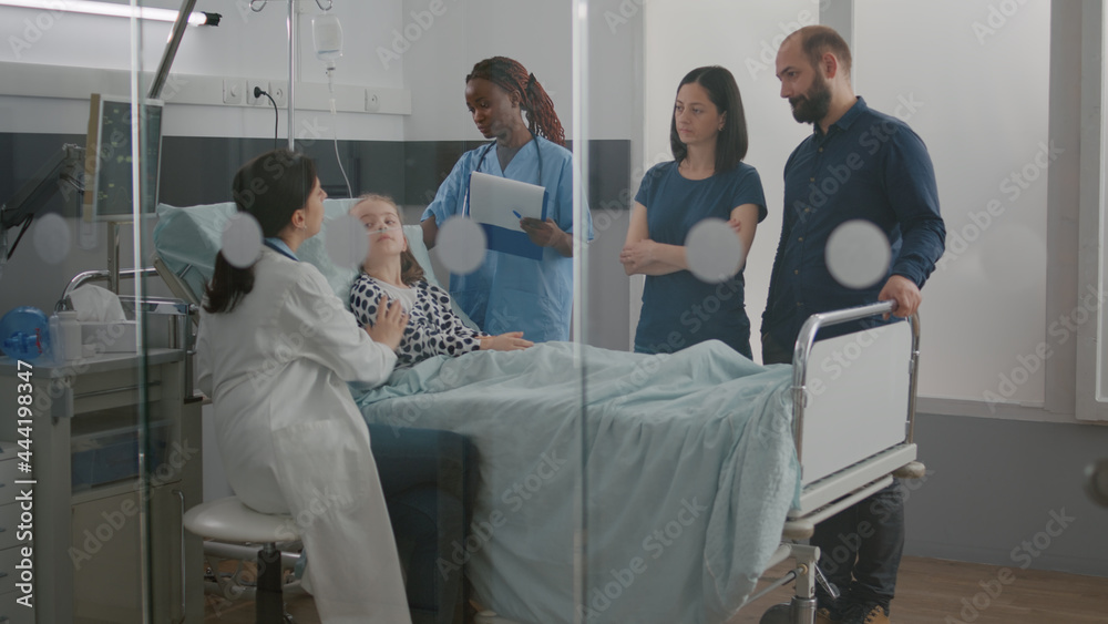 Pediatric doctor examining breathing sickness symptoms while african ...