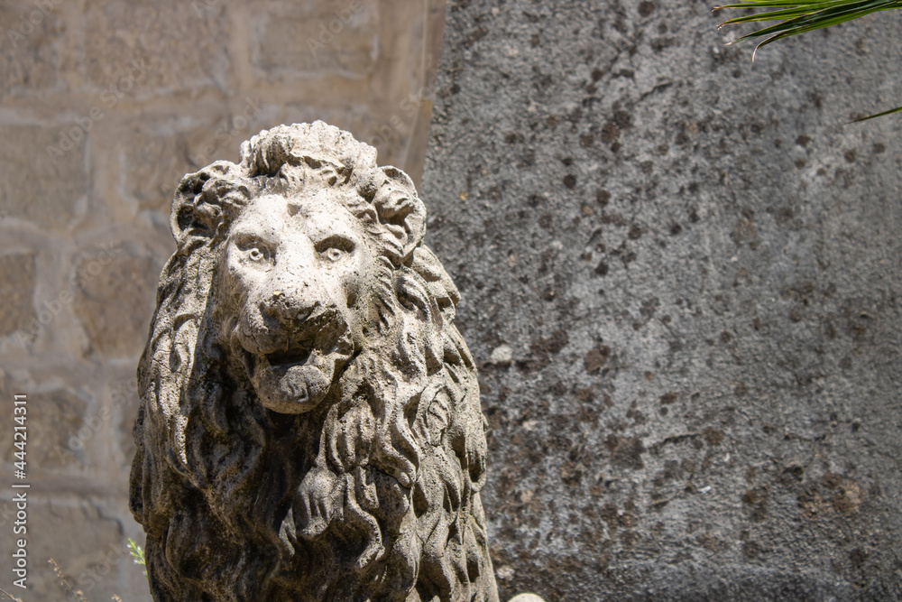 Stone sculpture lion. The head and mane king animals in full face near ...
