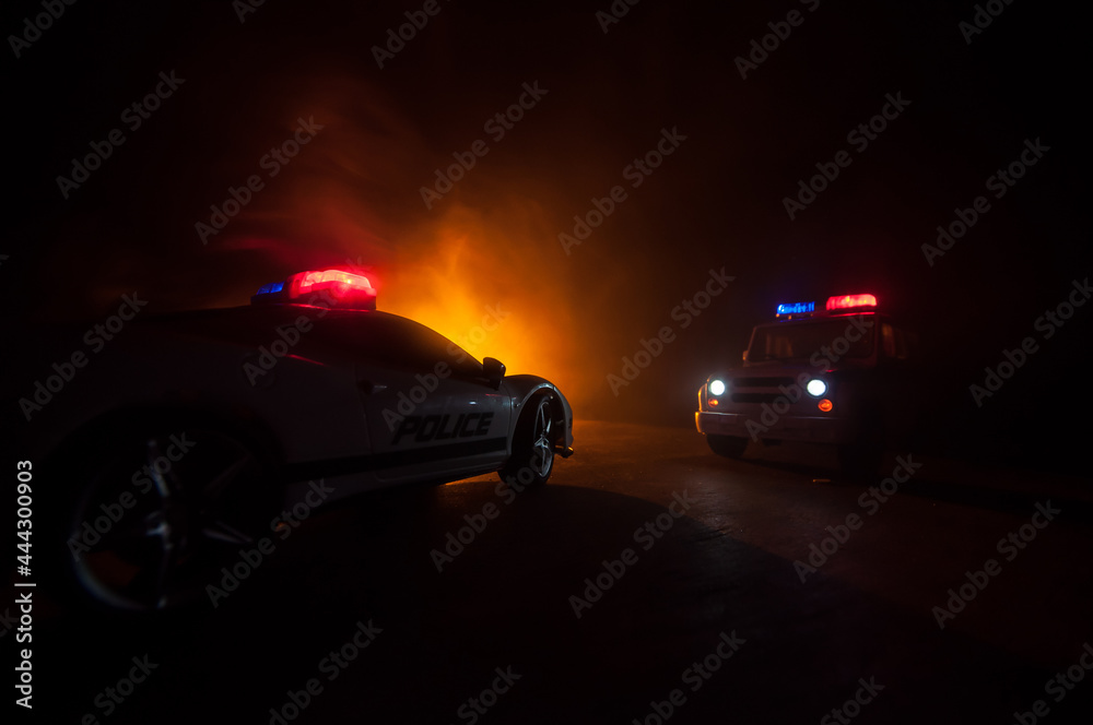 Police car chasing a car at night with fog background. 911 Emergency ...