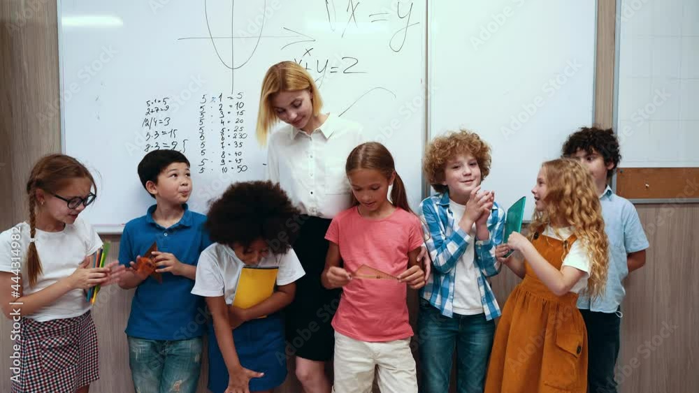 Children studying and having fun at school. Multiethnic group of kids ...