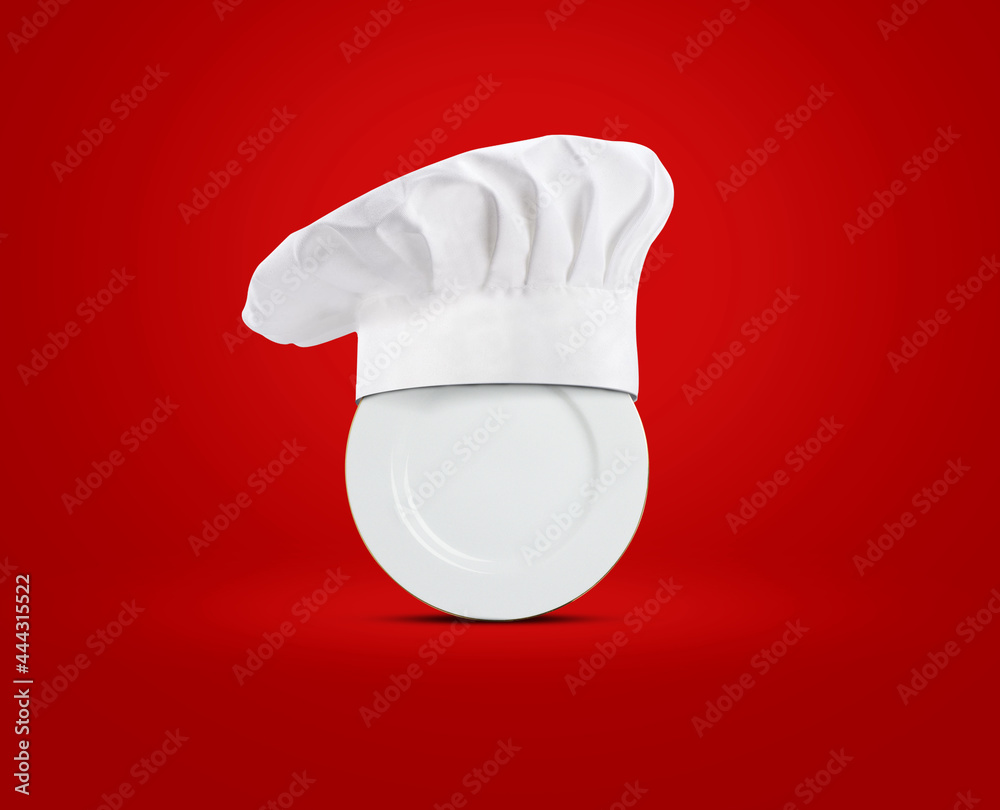 Chef hat with empty plate on red background, top plate with chef hat ...