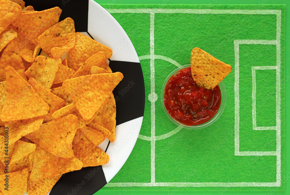 Football soccer party table. Corn nacho chips on big plate painted like ...