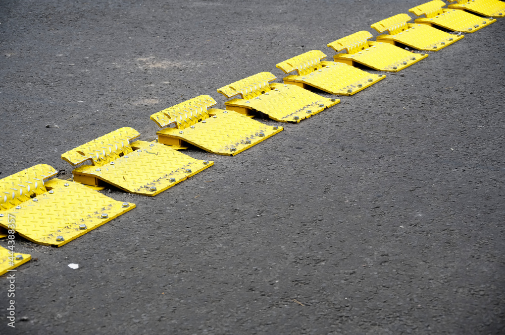 Yellow flow traffic control plates for one way direction of cars Stock ...