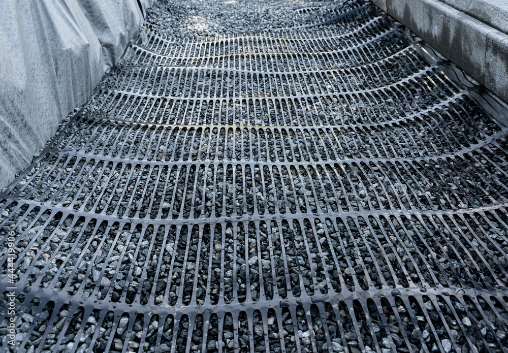 Reinforced geo net on top of crushed rocks at a construction site ...