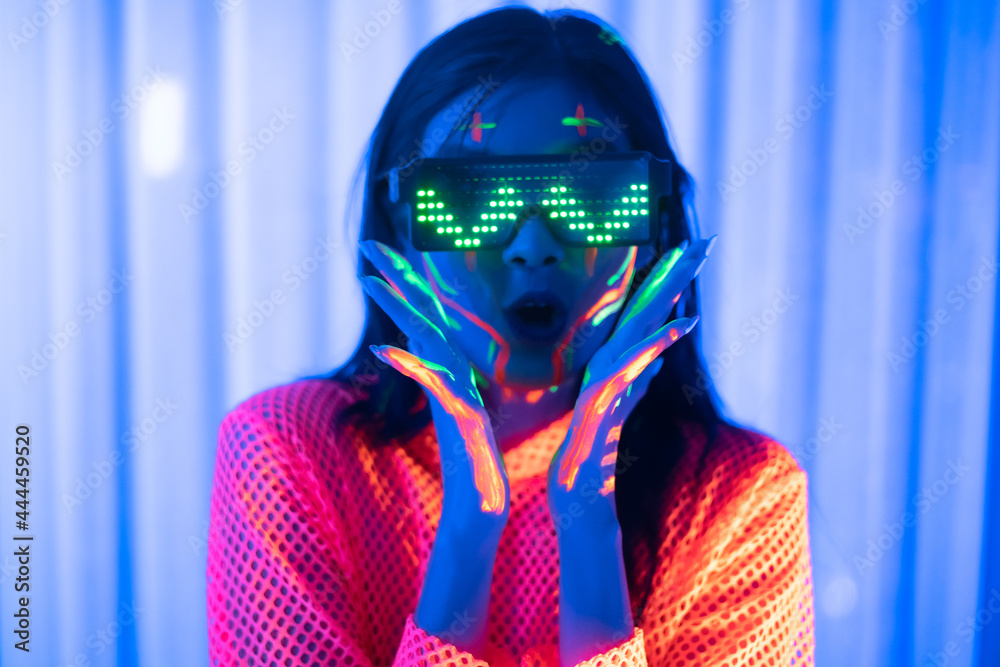 Neon asian woman dancing. Fashion model woman in neon light, portrait ...